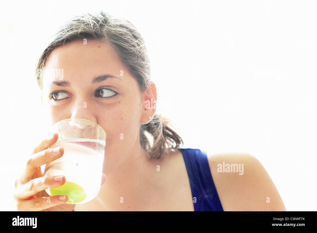 Teenage girl drinking water Stock Photo - Alamy