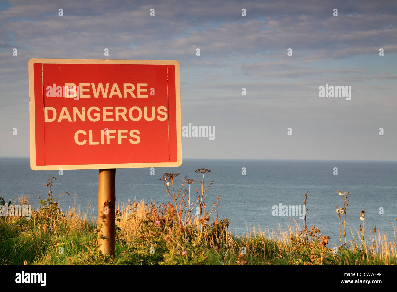 Beware Dangerous Cliffs Sign Stock Photo - Alamy