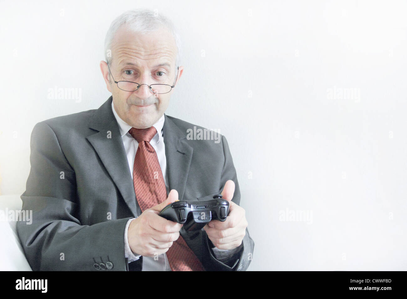 Businessman playing video games Stock Photo - Alamy