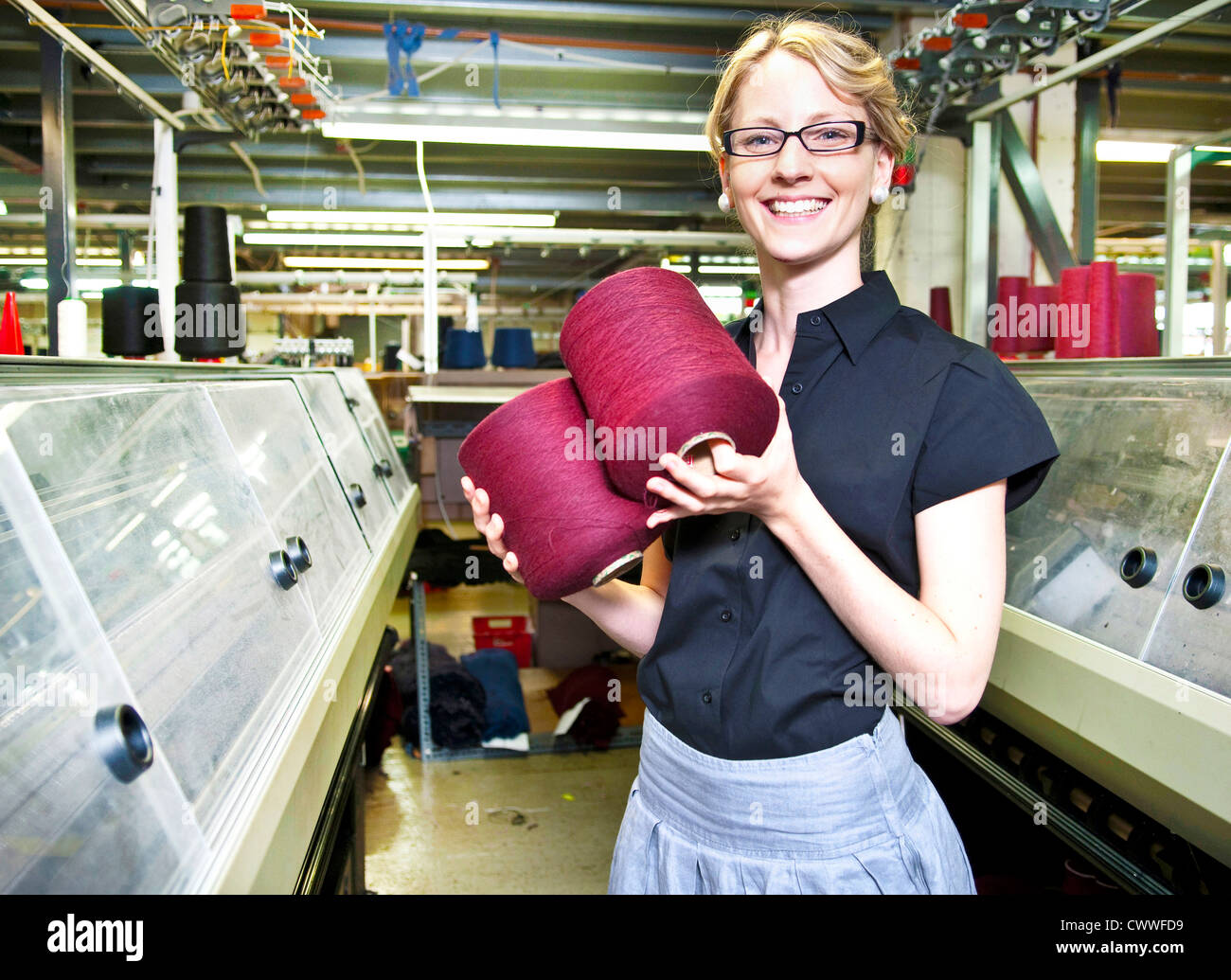 Woman working cloth spools hi-res stock photography and images - Alamy