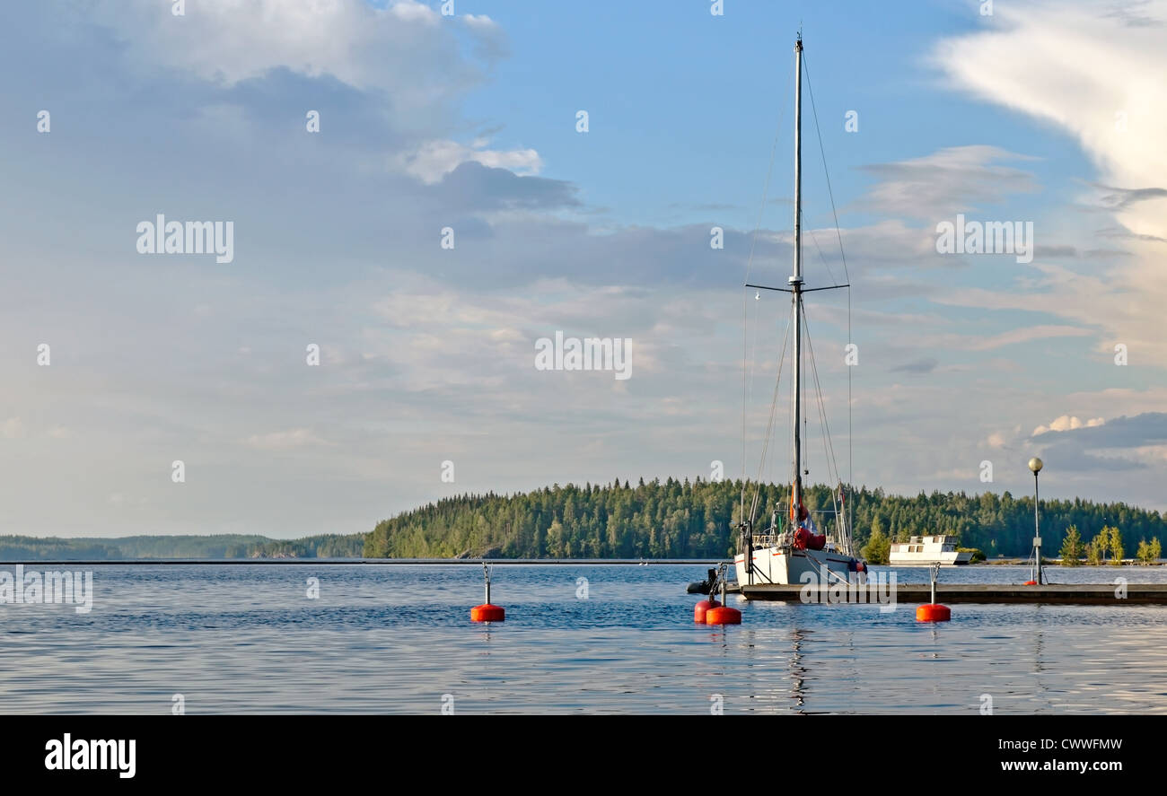 Yacht and red moorings buoys in small European marina. Imatra town ...