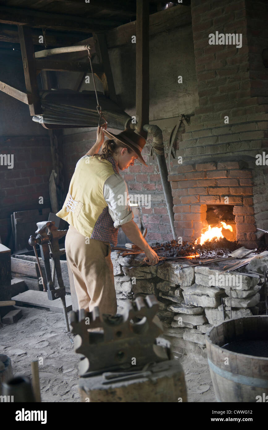 Blacksmith at his forge making a knife using traditional methods Stock ...