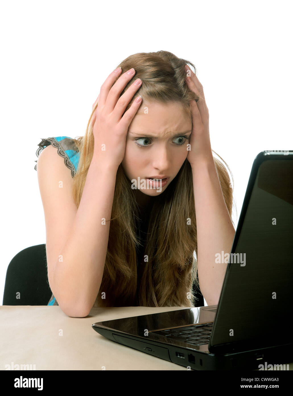 girl with horror looks at the laptop screen Stock Photo - Alamy