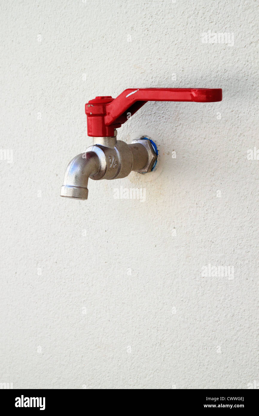 a faucet on white wall background in home Stock Photo - Alamy