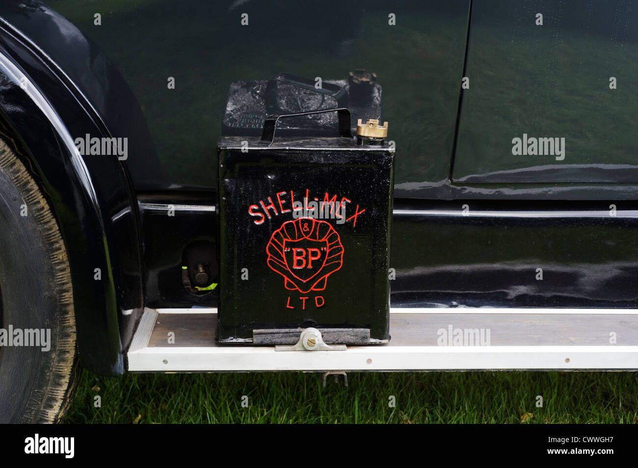 Vintage Shell Mex petrol can on the side runner of a vintage car at a ...