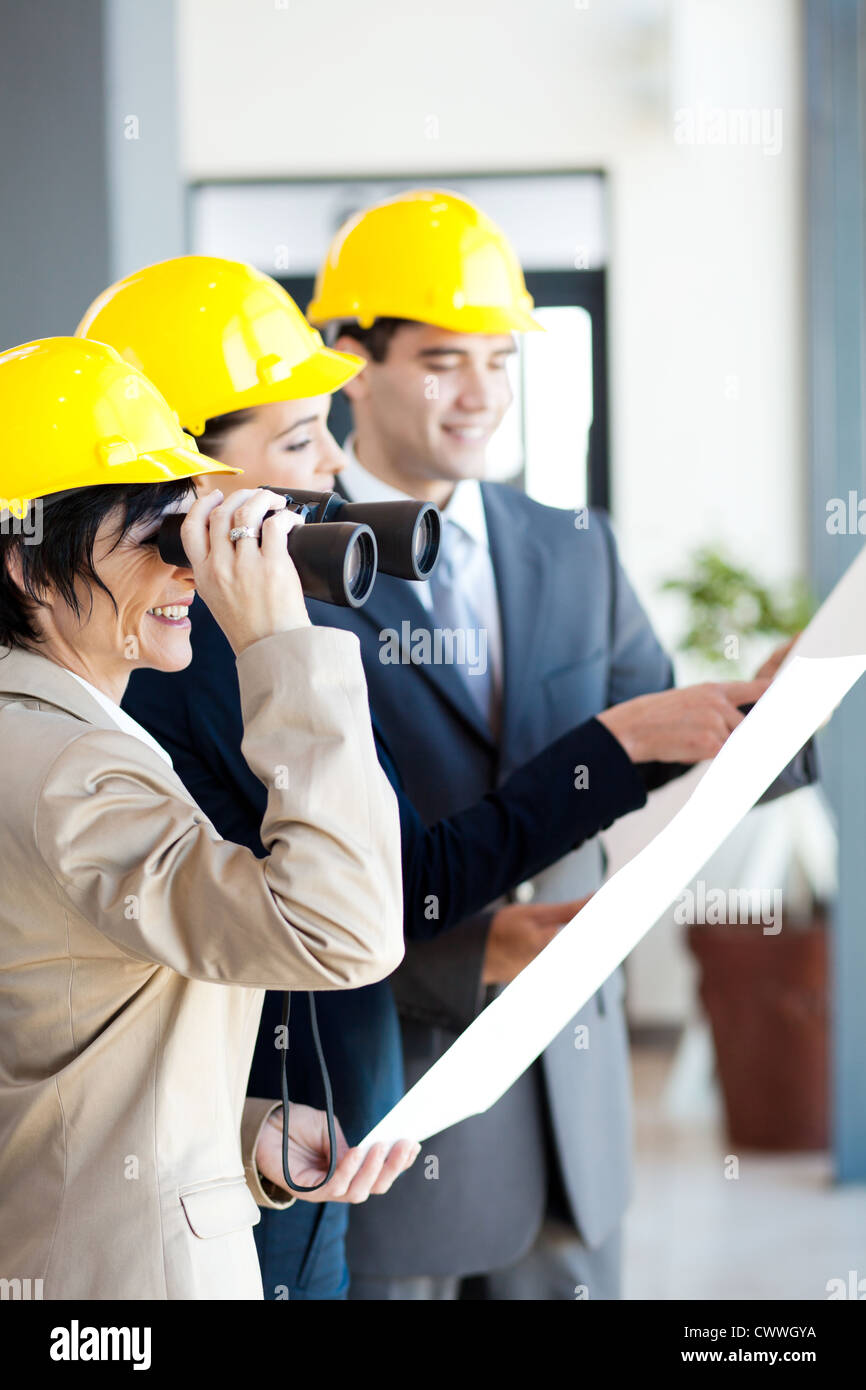 architect looking at construction site with binoculars Stock Photo - Alamy