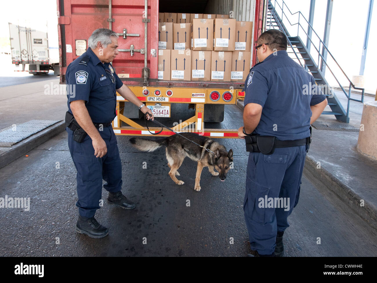 Customs and Border Protection officers check trucks for possible drugs ...