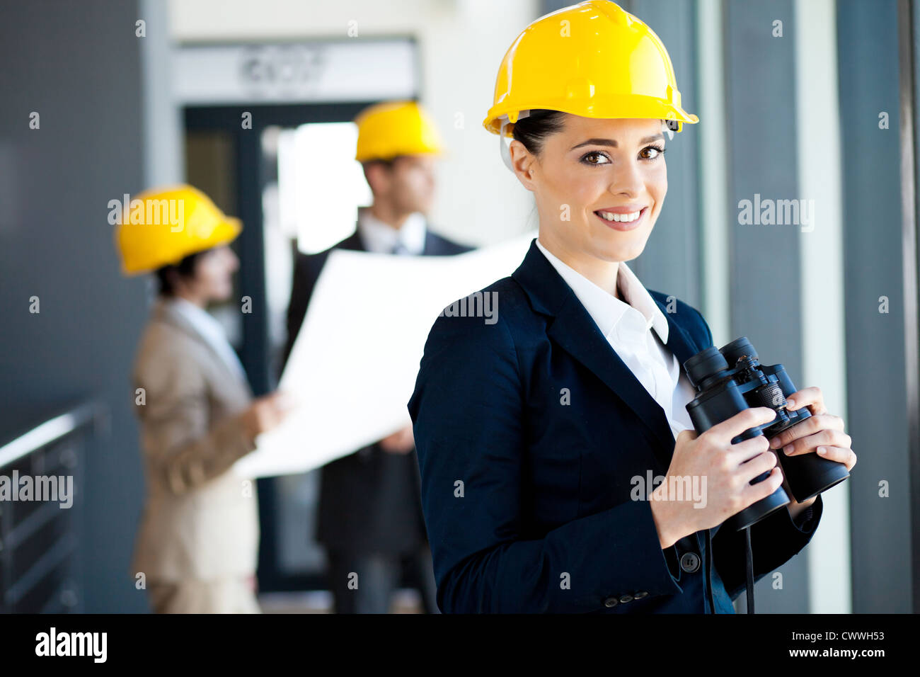 female construction manager with binoculars Stock Photo - Alamy