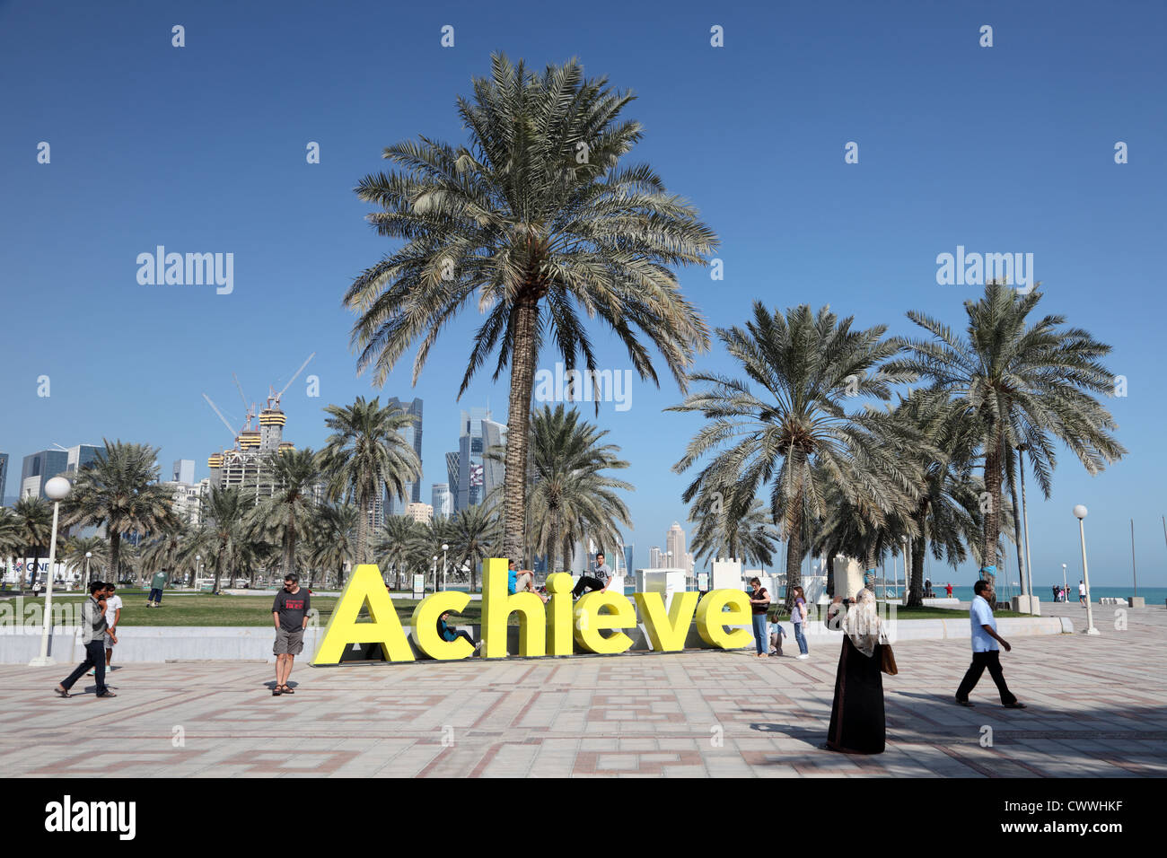 Slogan Achieve on the corniche of Doha, Qatar Stock Photo - Alamy