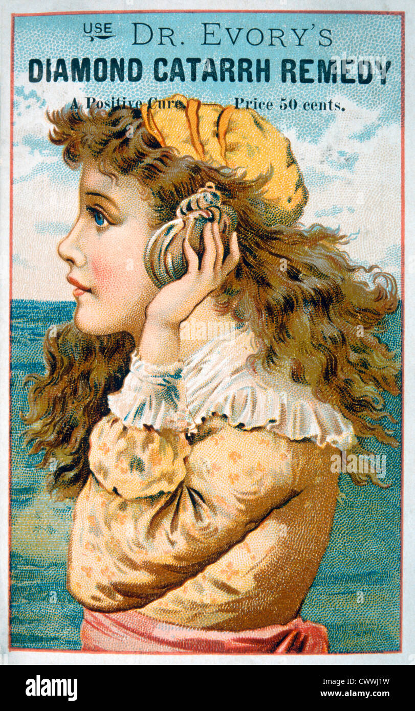 Woman holding seashell to ear hi-res stock photography and images - Alamy