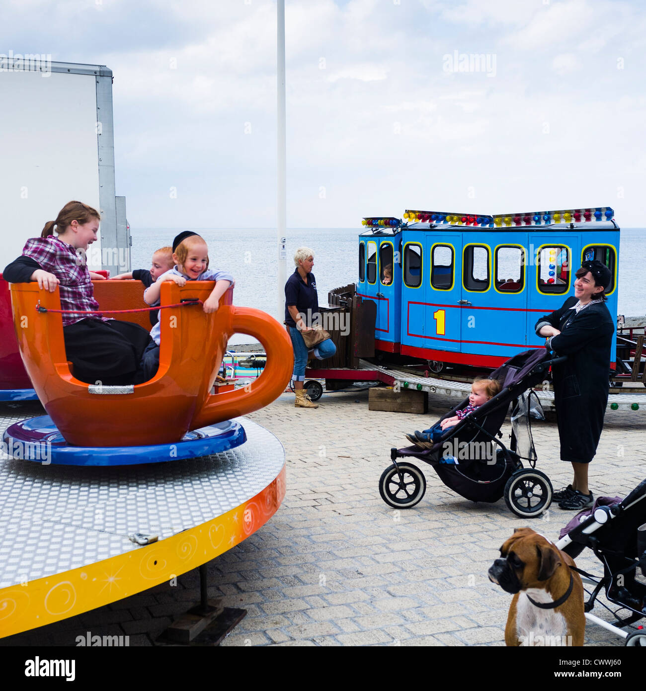 Orthodox jewish children having fun on a fairground ride on Aberystwyth ...