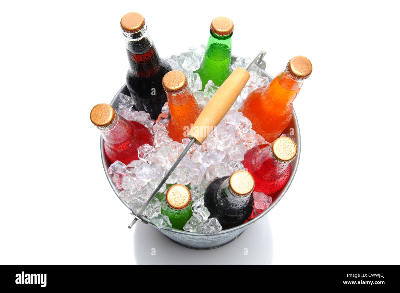 Top shot of a bucket full of assorted soda bottles over a white ...