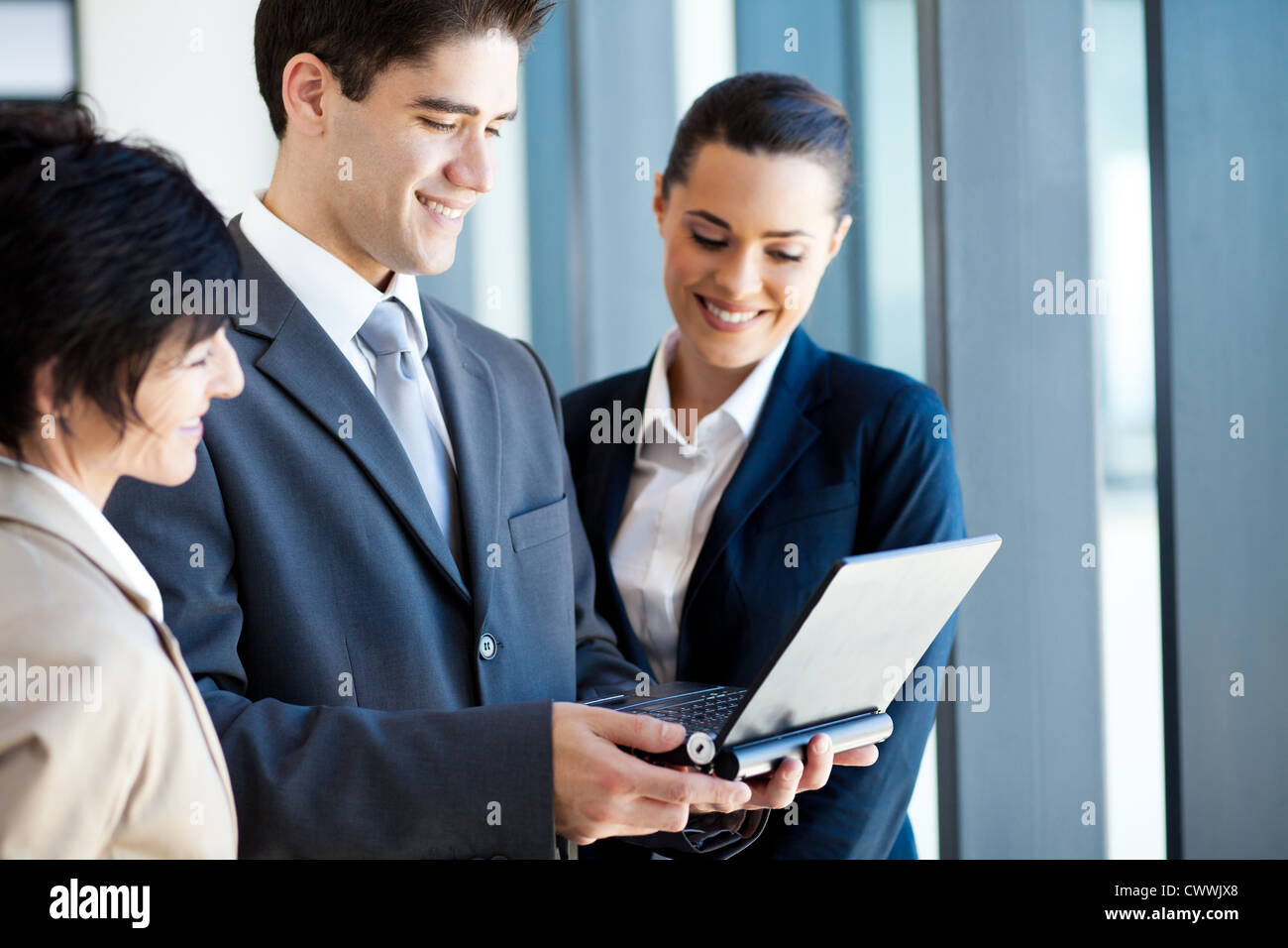 group of business people using laptop Stock Photo - Alamy