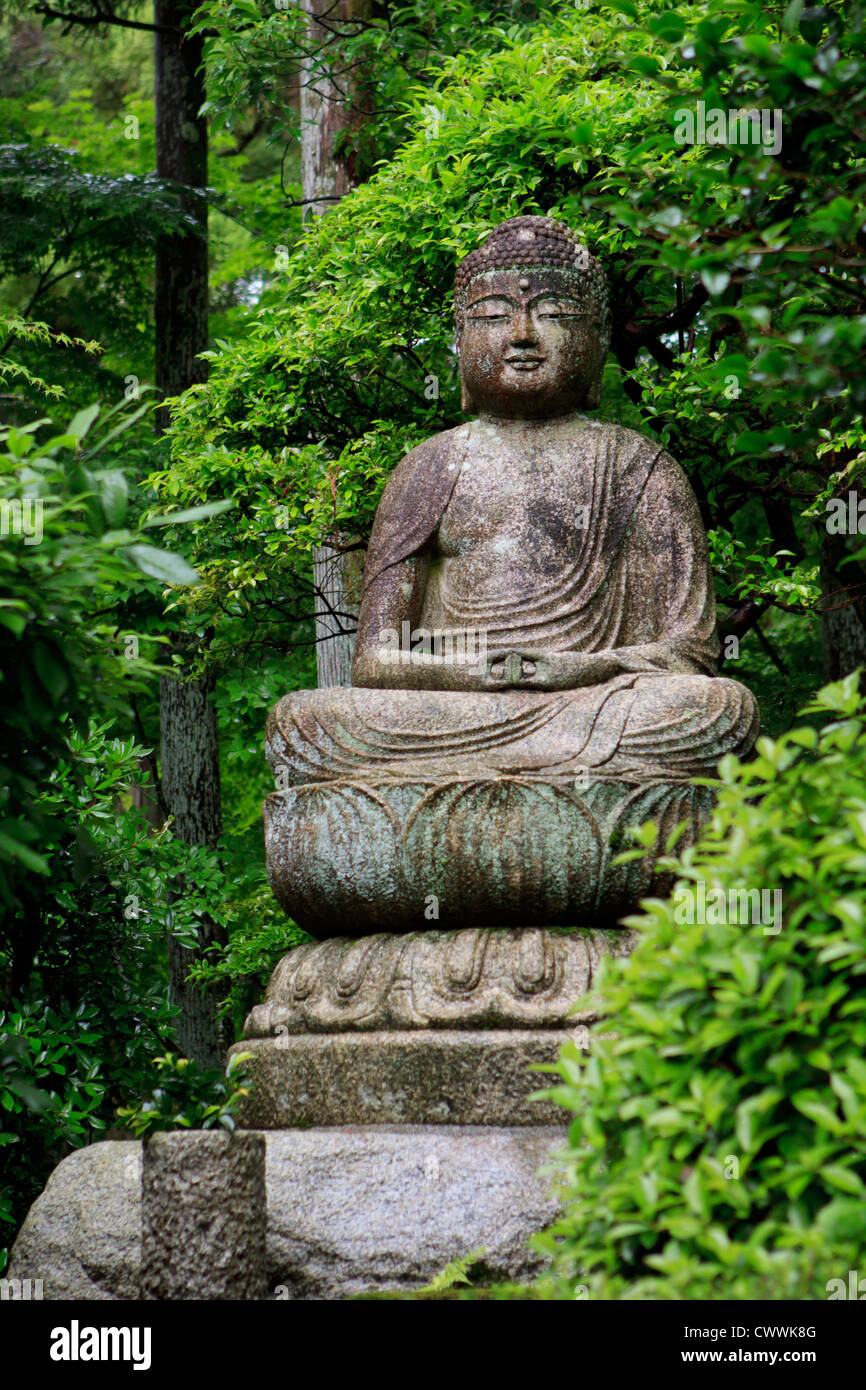 A stone Buddha statue in the grounds of Ryoan-Ji Temple in Kyoto, Japan ...
