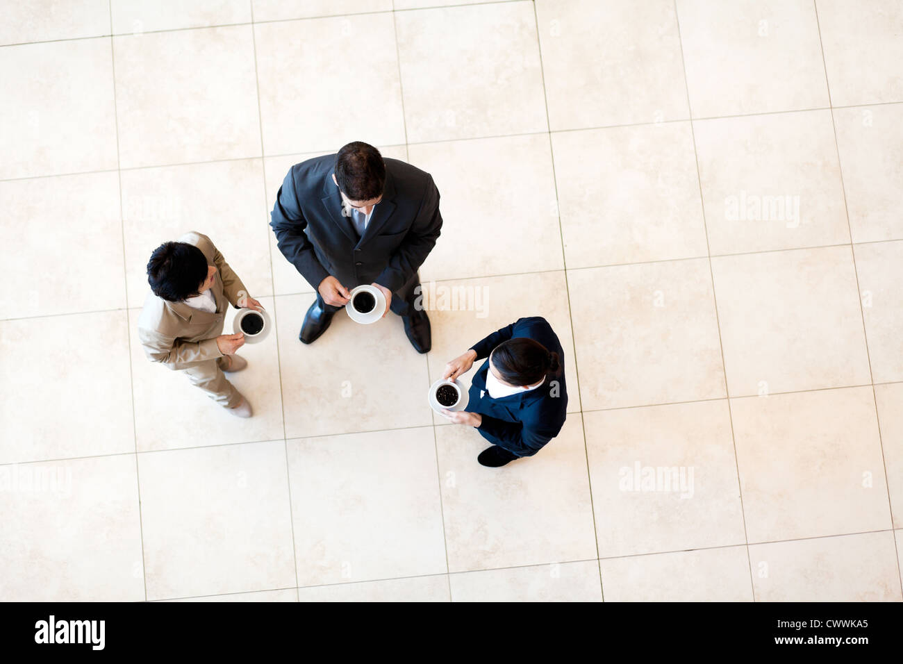 group of co-workers having coffee break at work Stock Photo - Alamy