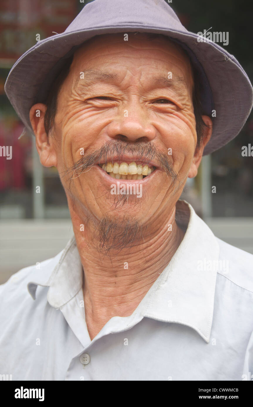 Shanghai, China - August 20, 2009: Unidentified Chinese man smiles at ...