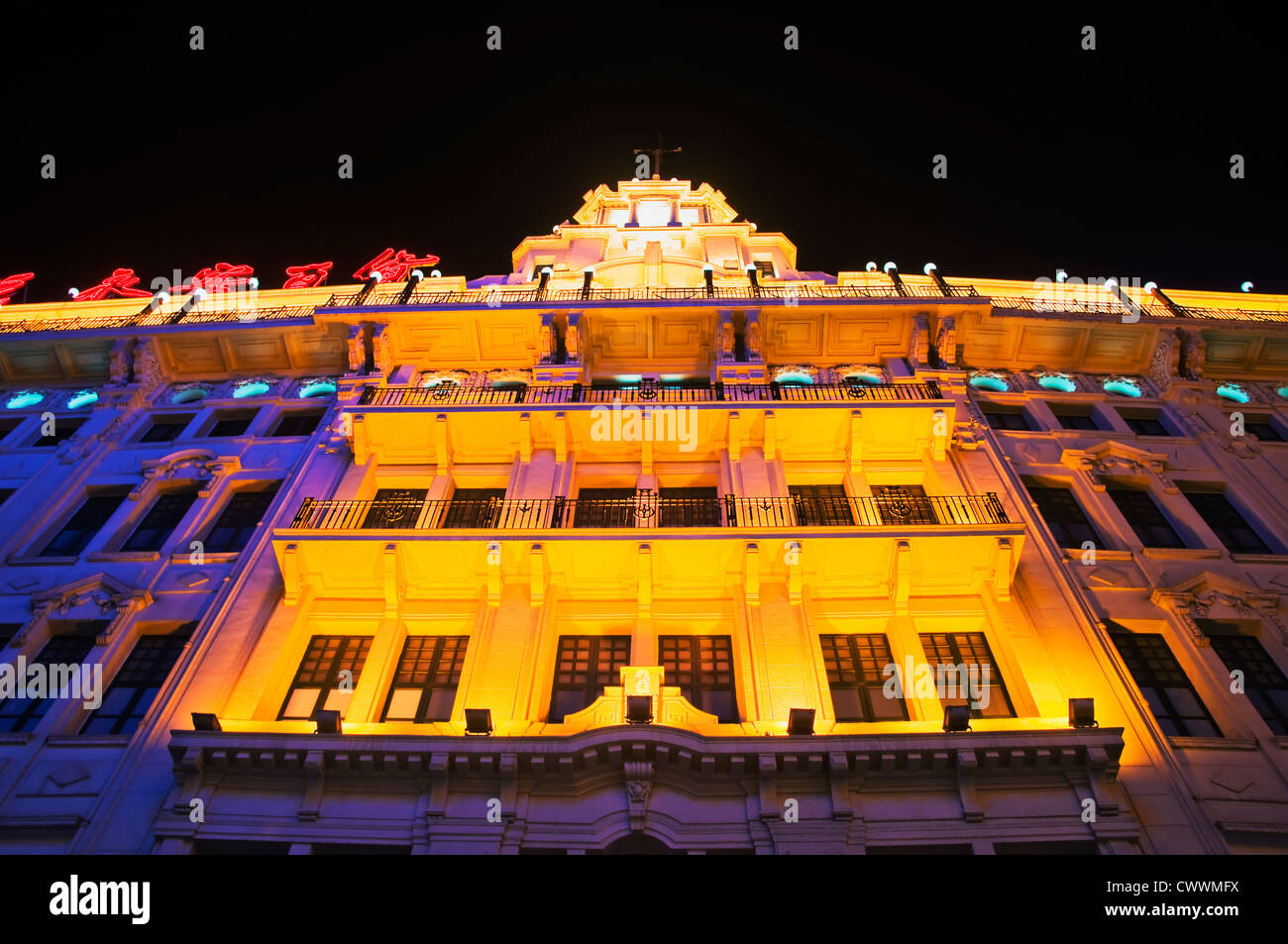 Shanghai, China - August 19, 2009: Facade of a neon-lit old building ...