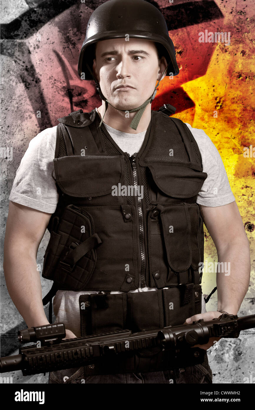 Armed police against urban texture background colors orange Stock Photo ...