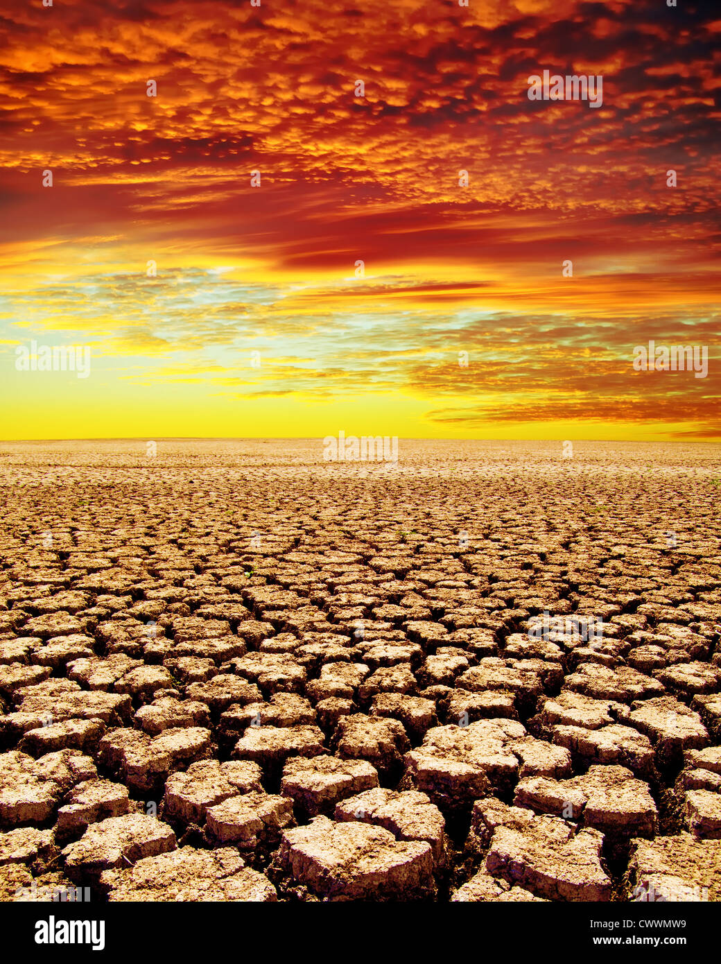 drought land under red clouds Stock Photo - Alamy