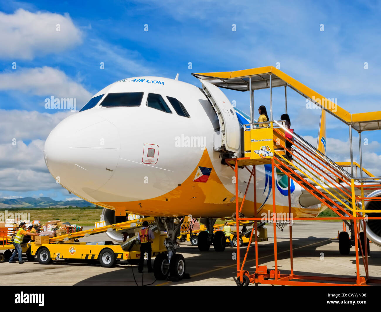 Gensan, Philippines - April 2, 2011: Passengers board a Cebu Pacific ...