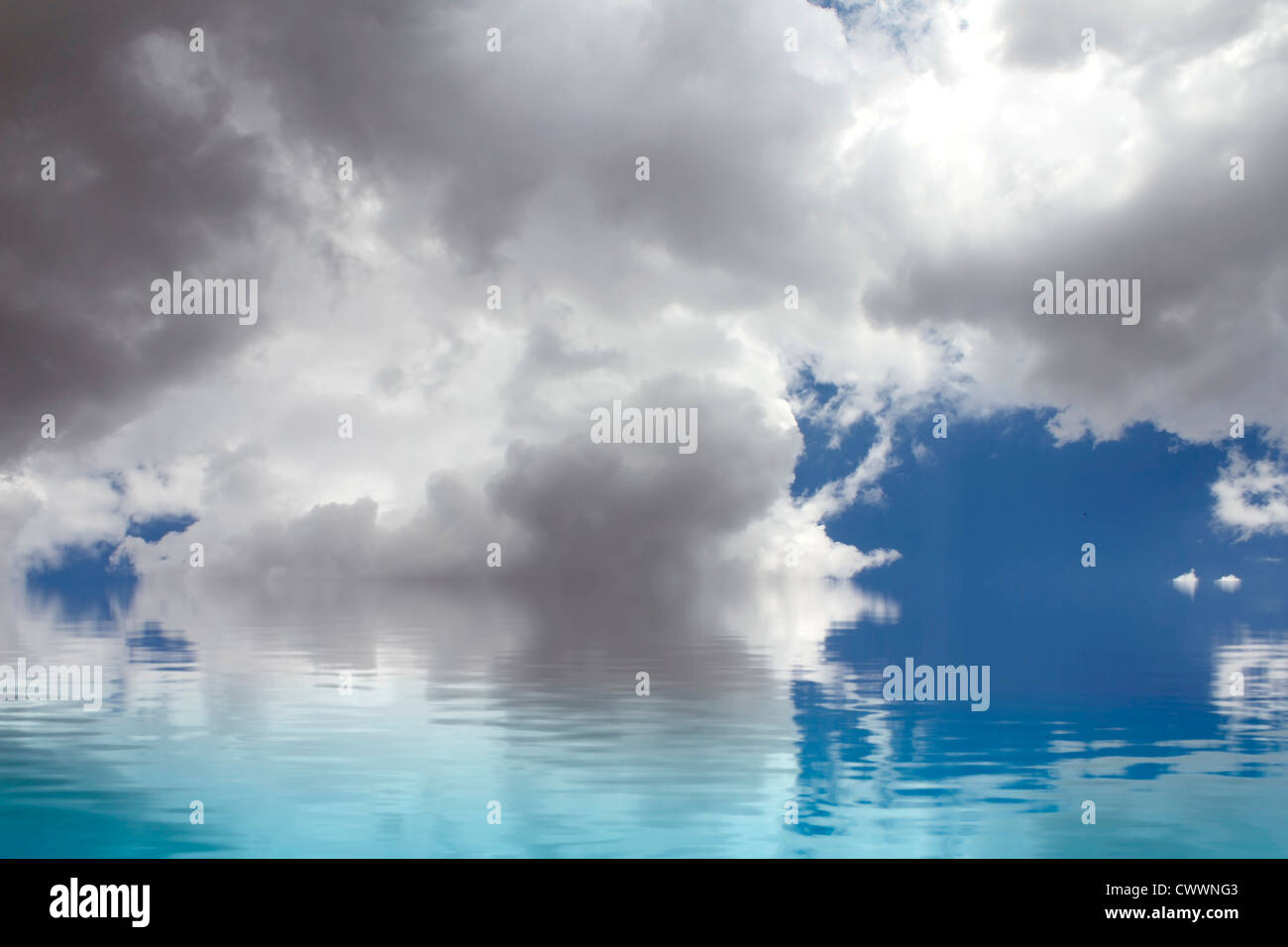 Clam sea. A sky of clouds reflected in a water surface Stock Photo - Alamy