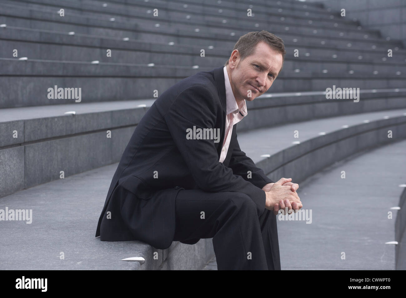 Mature men sitting side side steps hi-res stock photography and images ...