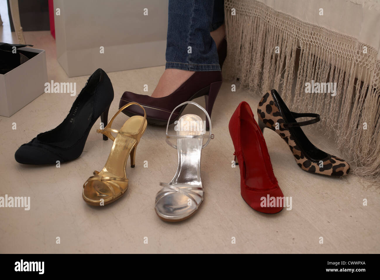 Young lady trying on shoes hi-res stock photography and images - Alamy