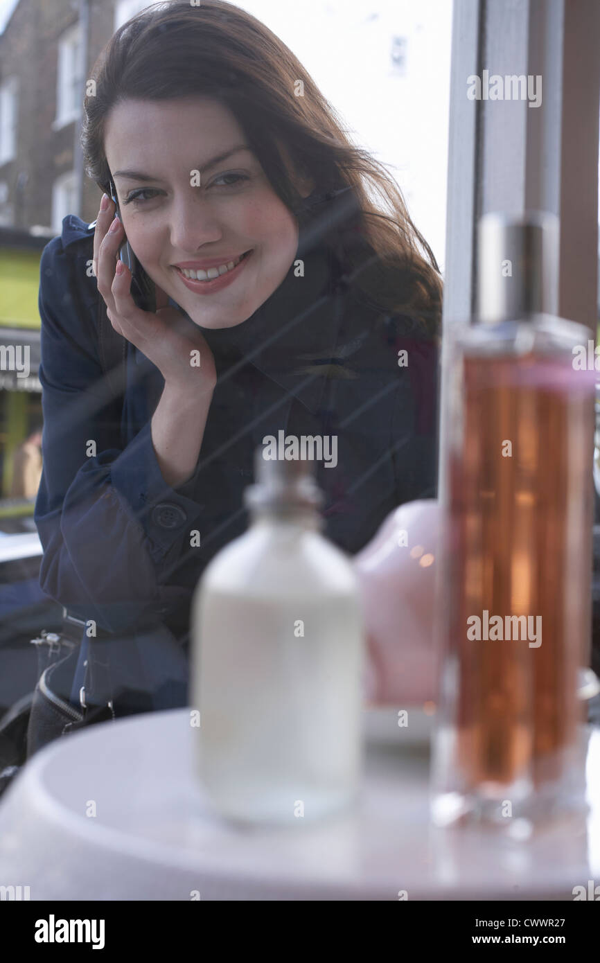 Woman window shopping on city street Stock Photo - Alamy