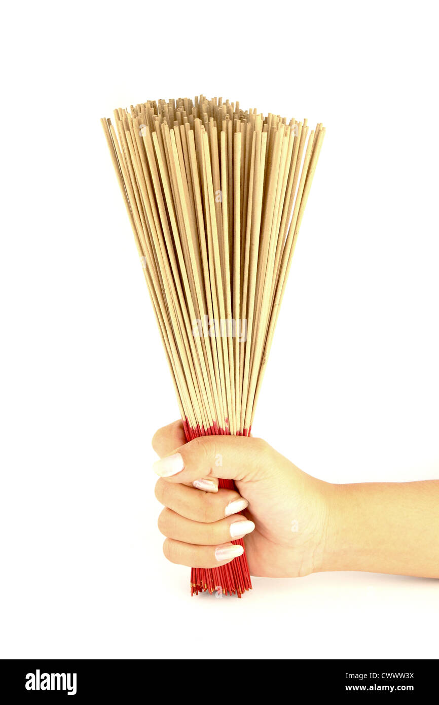 hand holding incense on white background Stock Photo - Alamy
