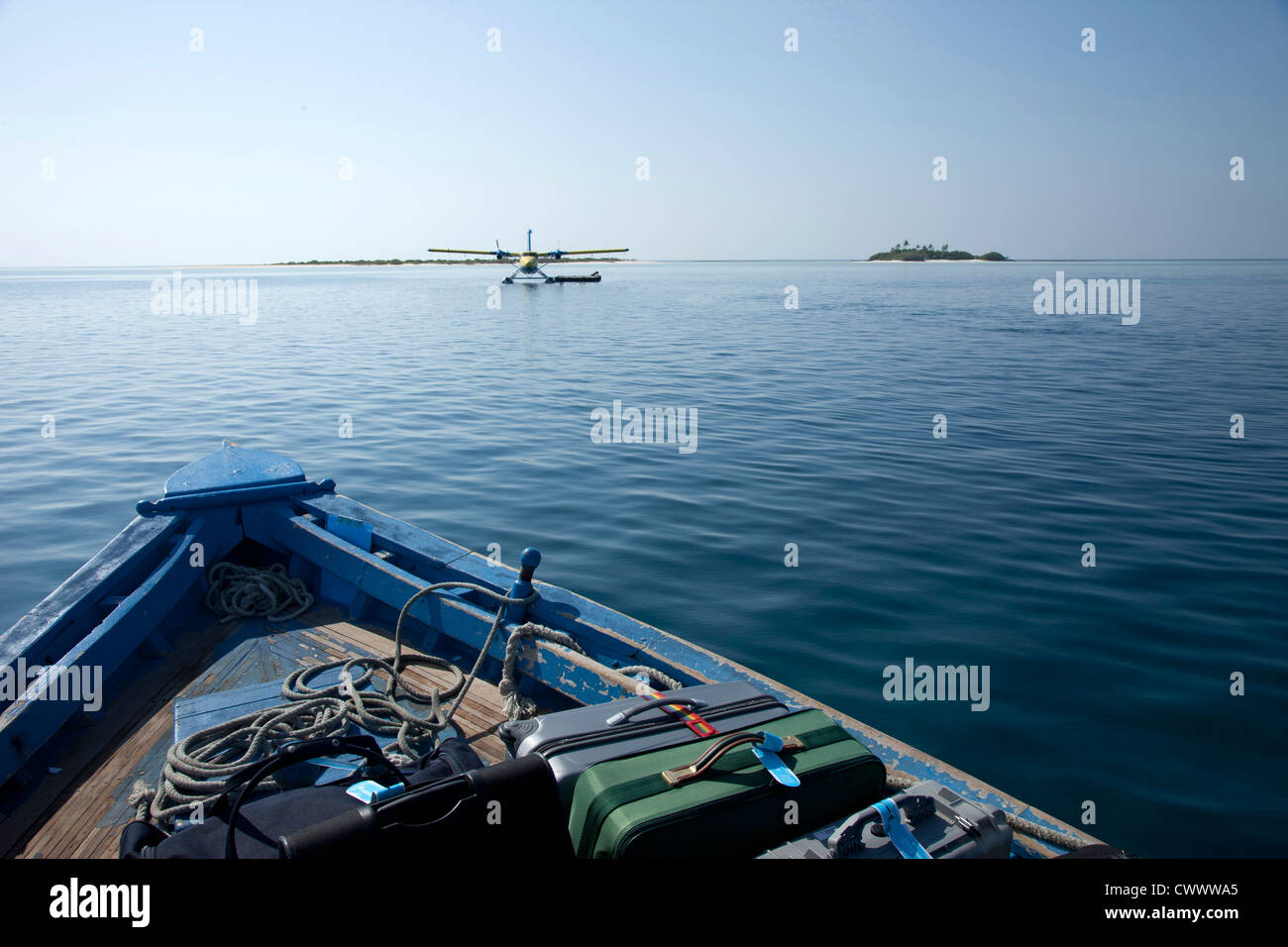 Water plane flying towards boat Stock Photo - Alamy