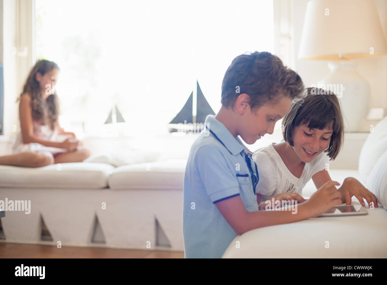 Children using tablet computer together Stock Photo - Alamy