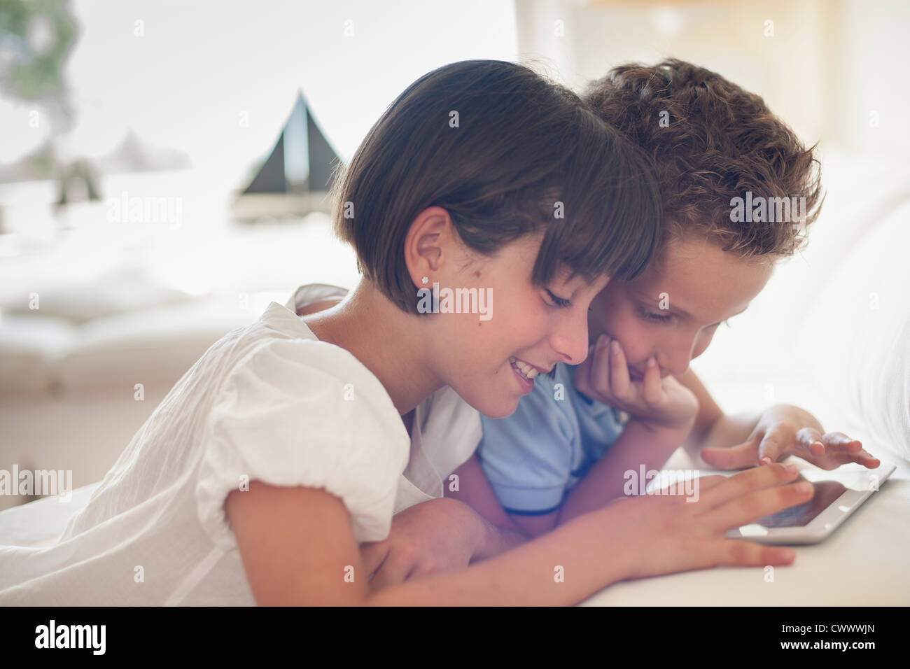 Children using tablet computer together Stock Photo - Alamy