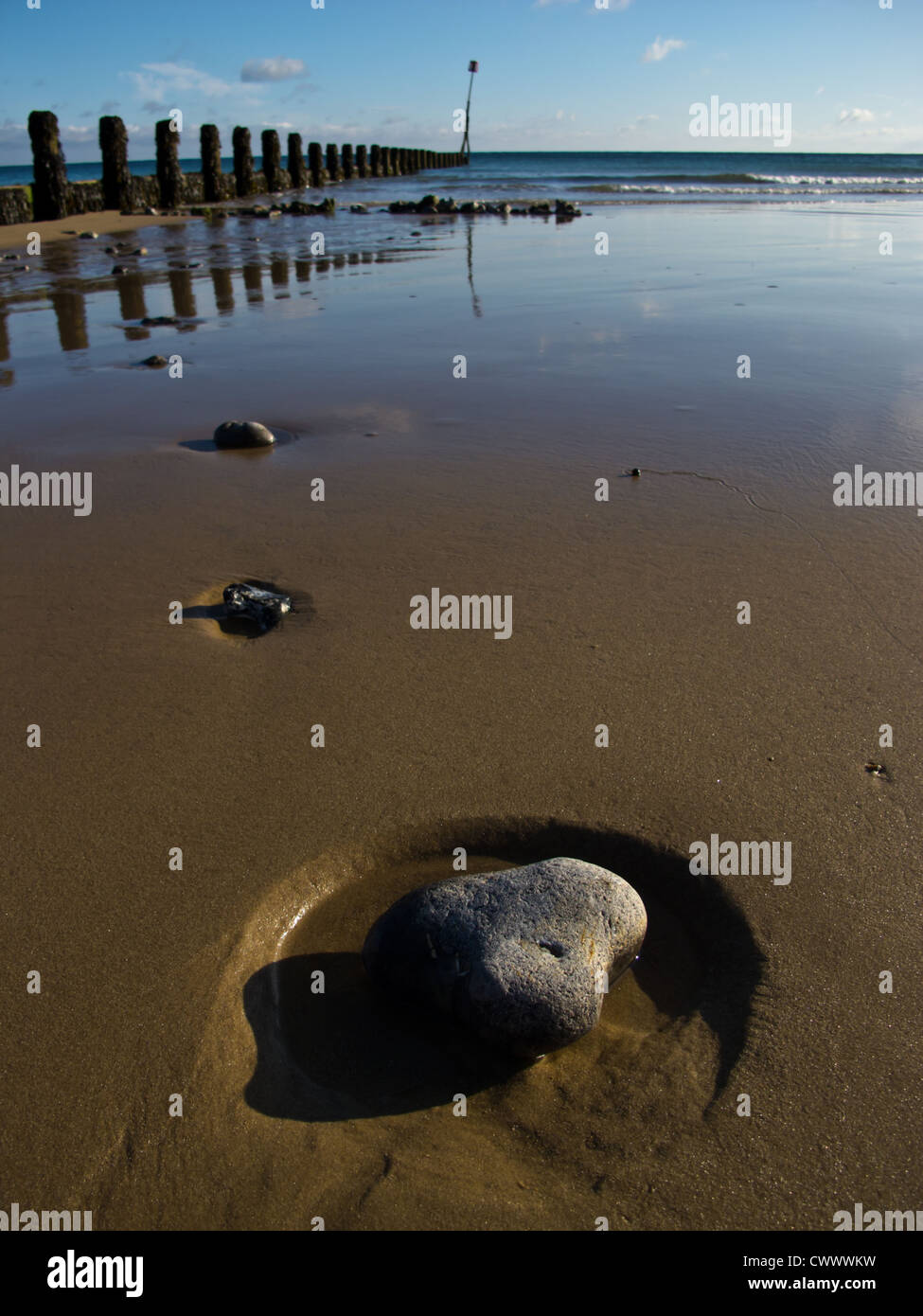 Beach patterns in sand stones and wooden groynes English beaches ...