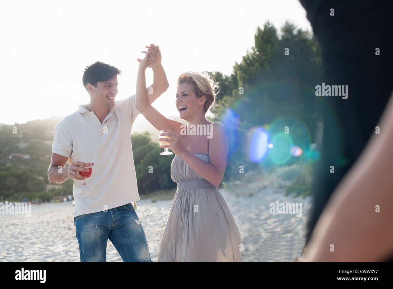 Couple dancing together on beach Stock Photo - Alamy