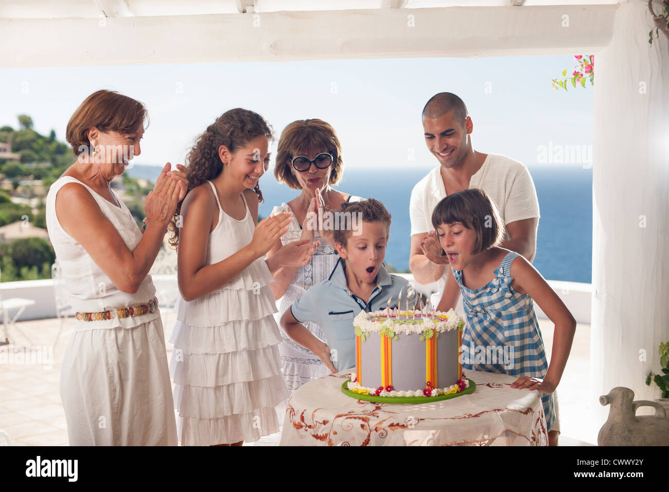 Family celebrating birthday together Stock Photo - Alamy