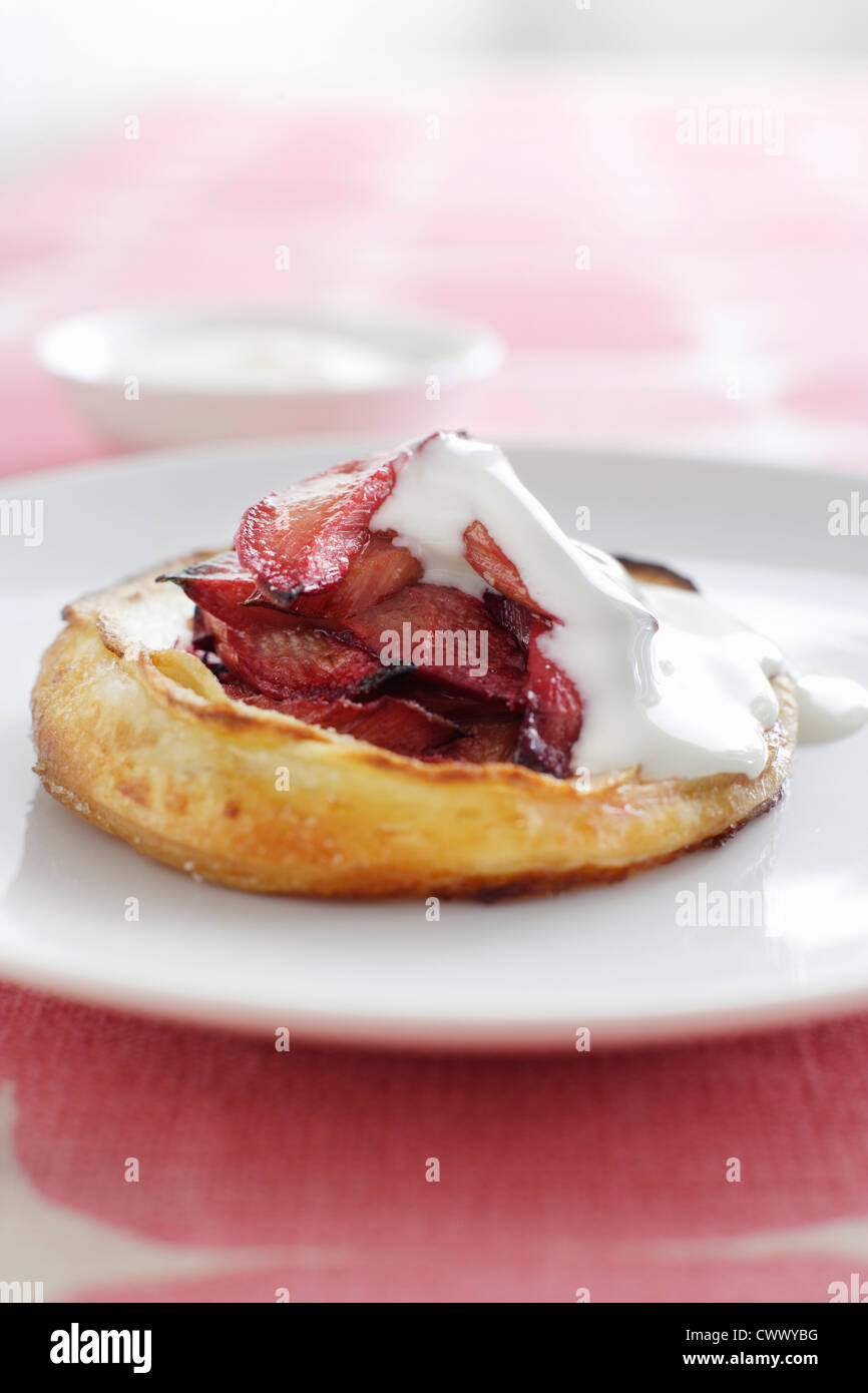 Plate of pastry with fruit and cream Stock Photo - Alamy