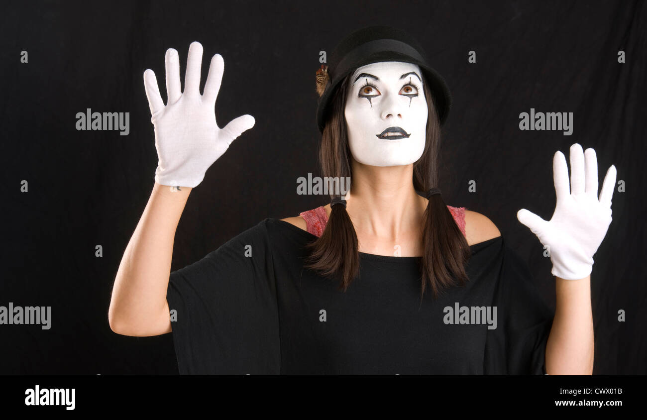 A beautiful and curious Mime peeks upwards Stock Photo - Alamy