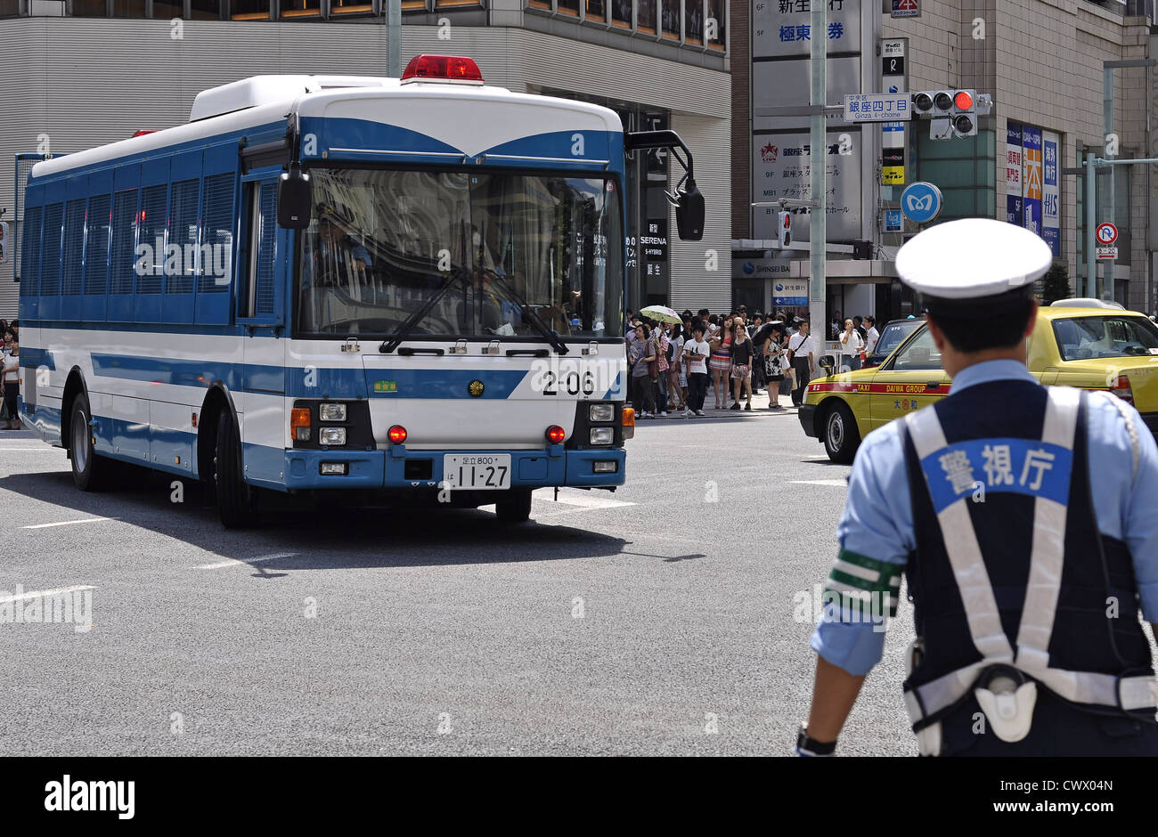 Police bus and policeman in Ginza district (Tokyo, Japan Stock Photo ...