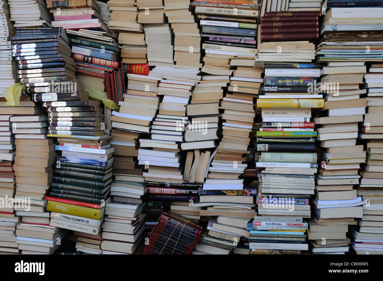 second hand piles of books stacked books second hand books stacked up ...