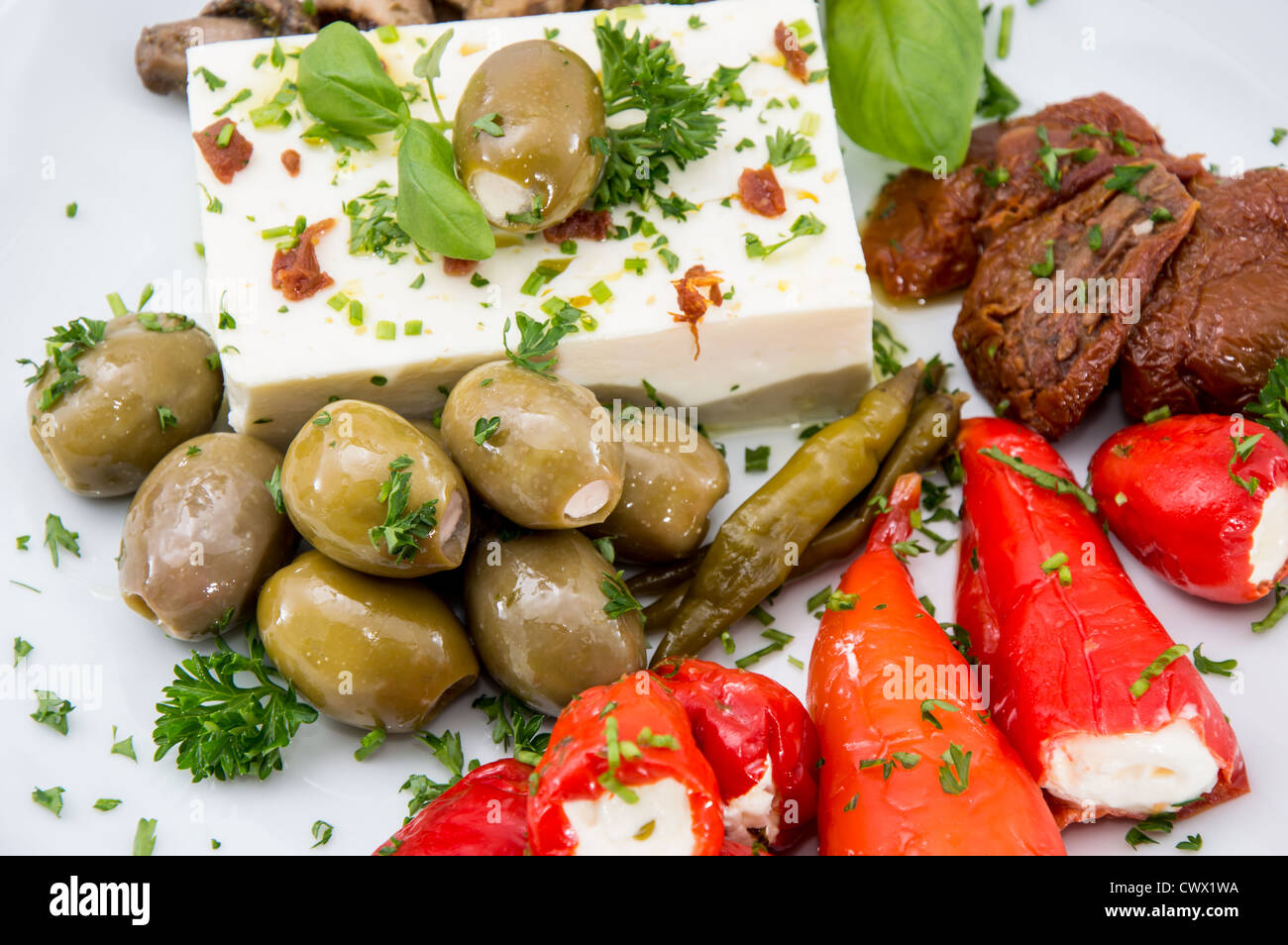 Different types of Antipasto on a plate against wood Stock Photo - Alamy