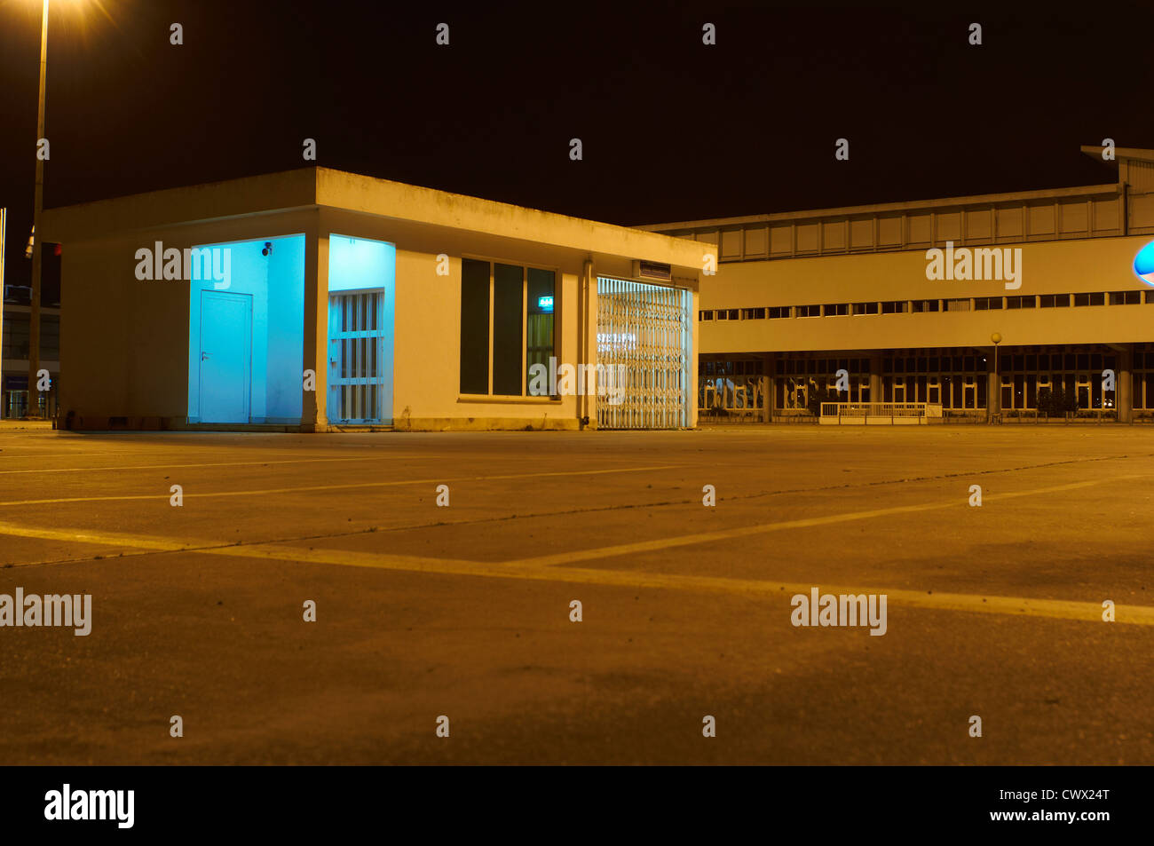 Parking lot building lit up at night Stock Photo - Alamy