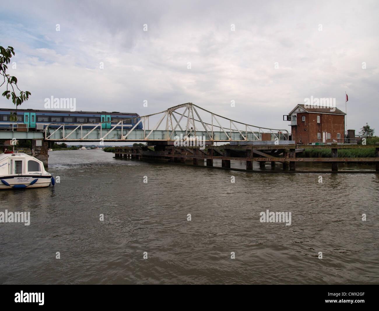 Train going across the Railway Swing Bridge, Reedham, Norfolk, UK Stock ...