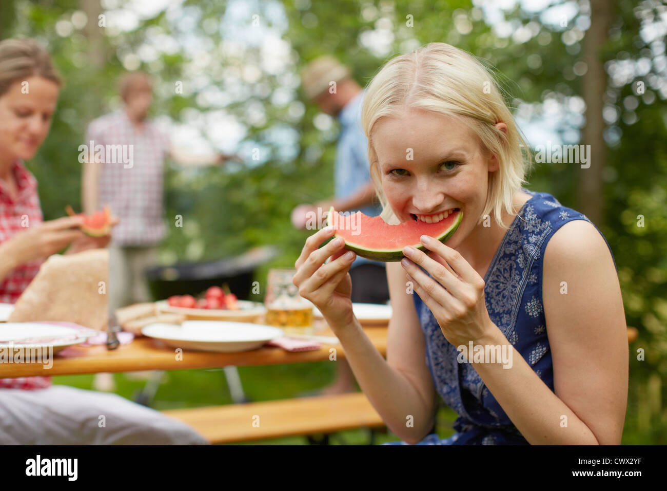 Woman eating watermelon outdoors Stock Photo - Alamy