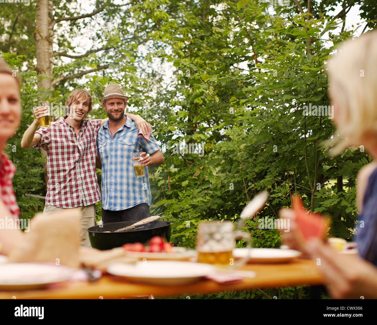 Friends drinking beer outdoors Stock Photo - Alamy