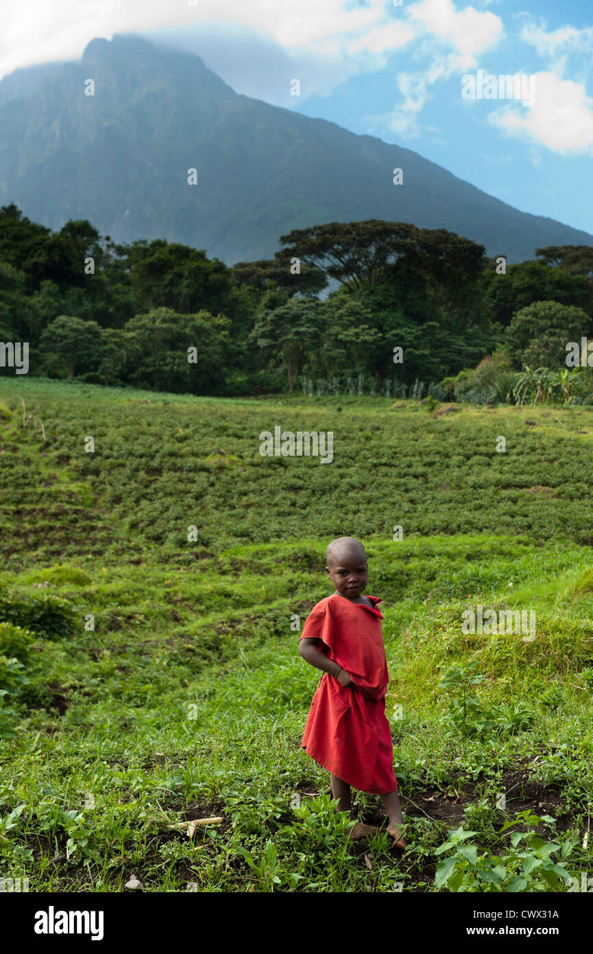 Child in front of Volcano Mount Mikeno, Virunga National Park, DR Congo ...