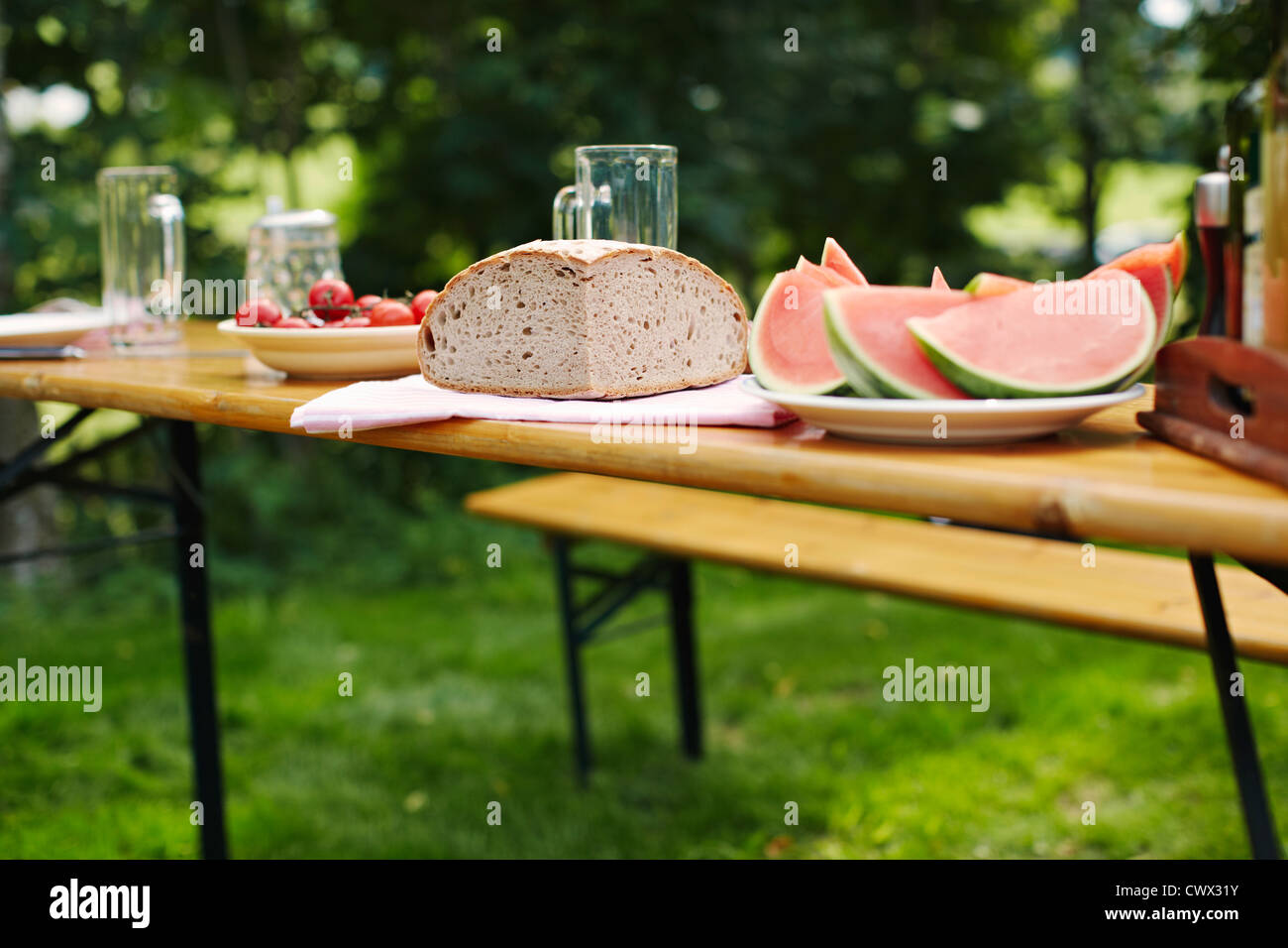 Fruit and bread on table outdoors Stock Photo - Alamy