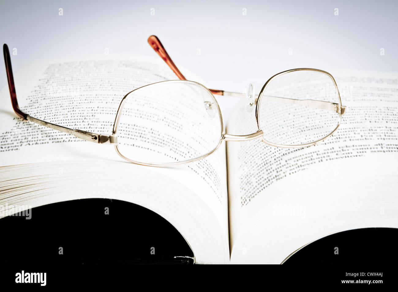 reading glasses and open book Stock Photo - Alamy