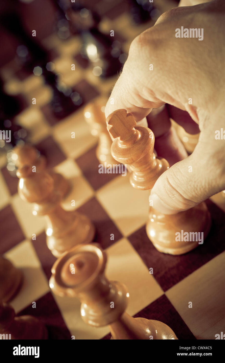 playing a chess king move Stock Photo - Alamy
