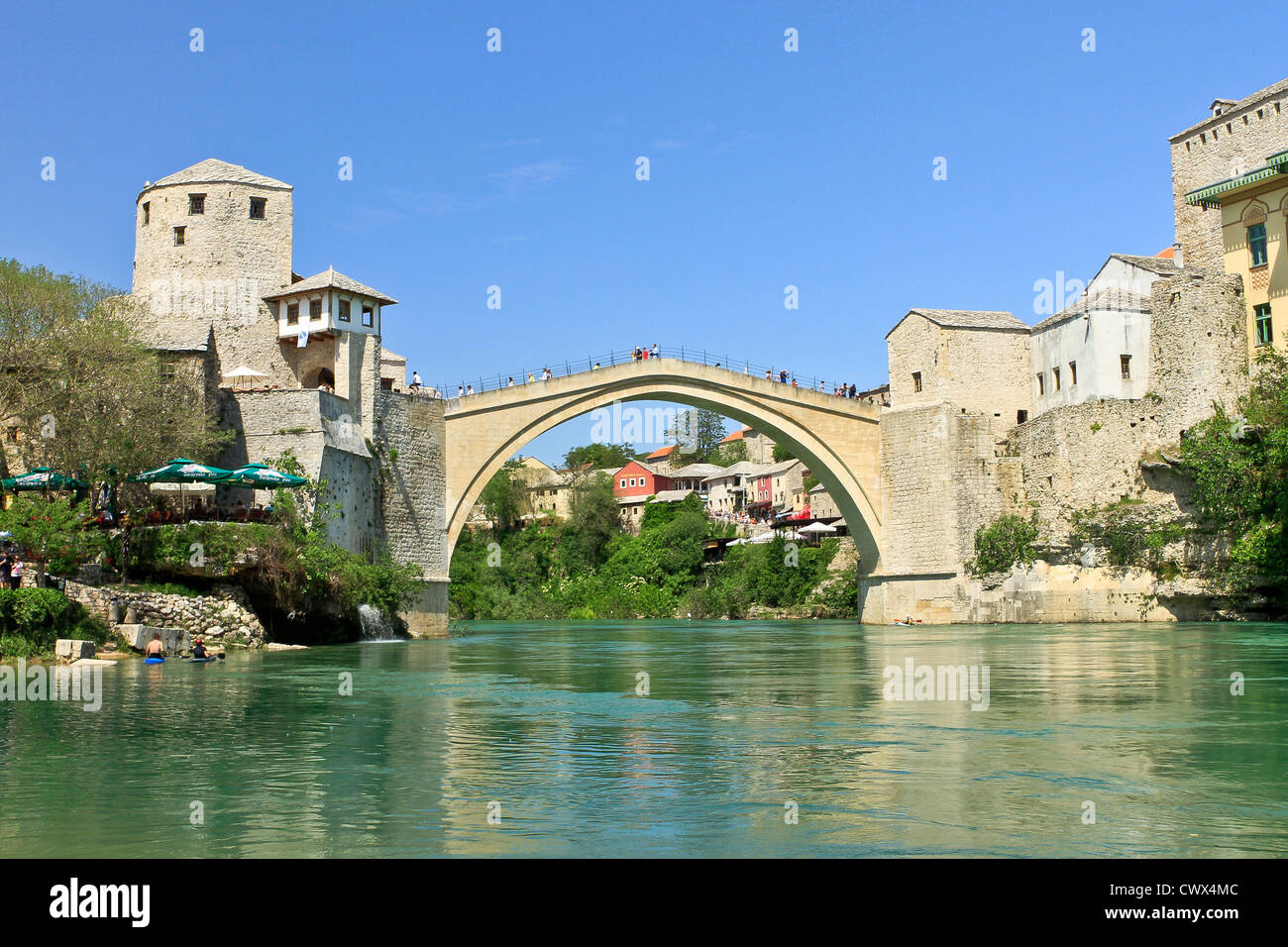 The Historic bridge At Mostar spand the green waters of the Neretva ...