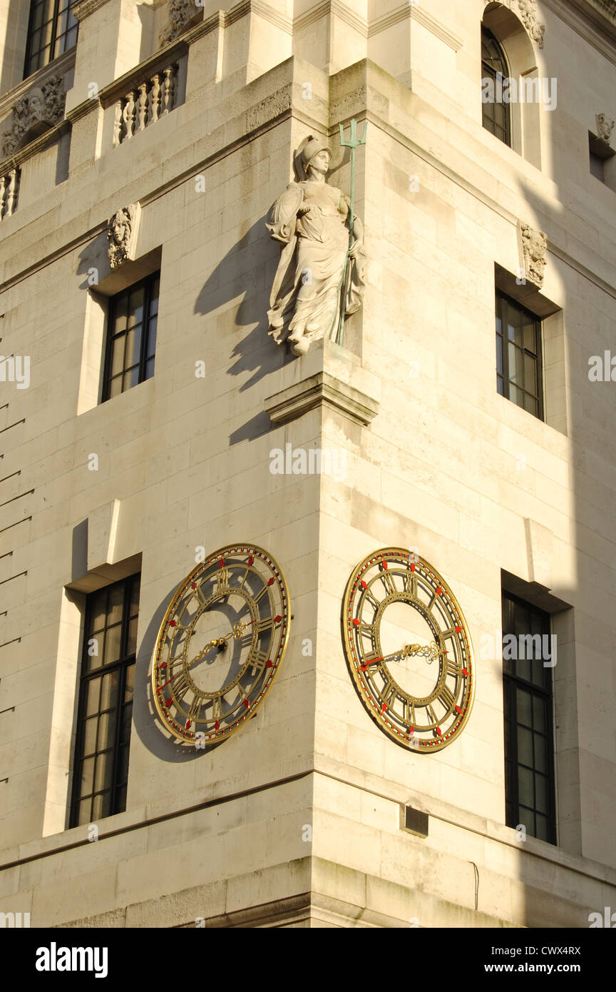 Clock faces on traditional office building in the City of London ...